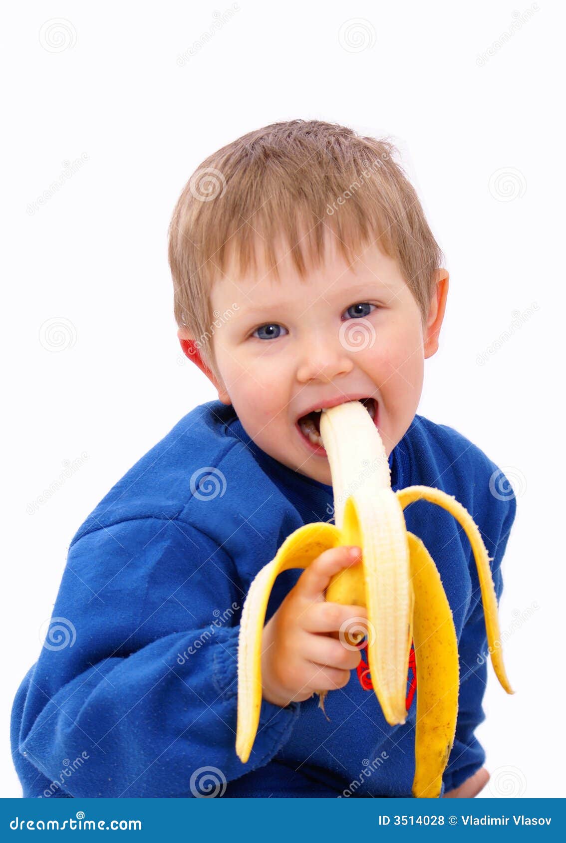 Smiling kid eats banana stock photo. Image of young, childhood - 3514028