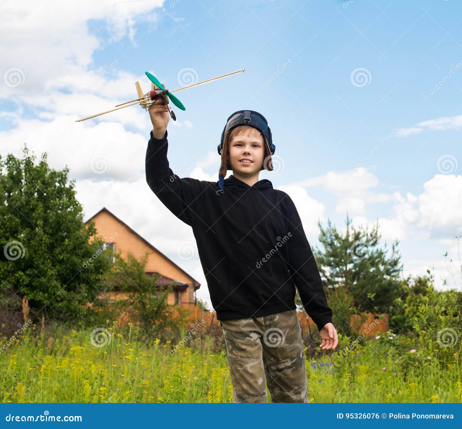 Smiling Kid in Pilot Helmet with Plane Model Outdoors. Dream. Stock ...