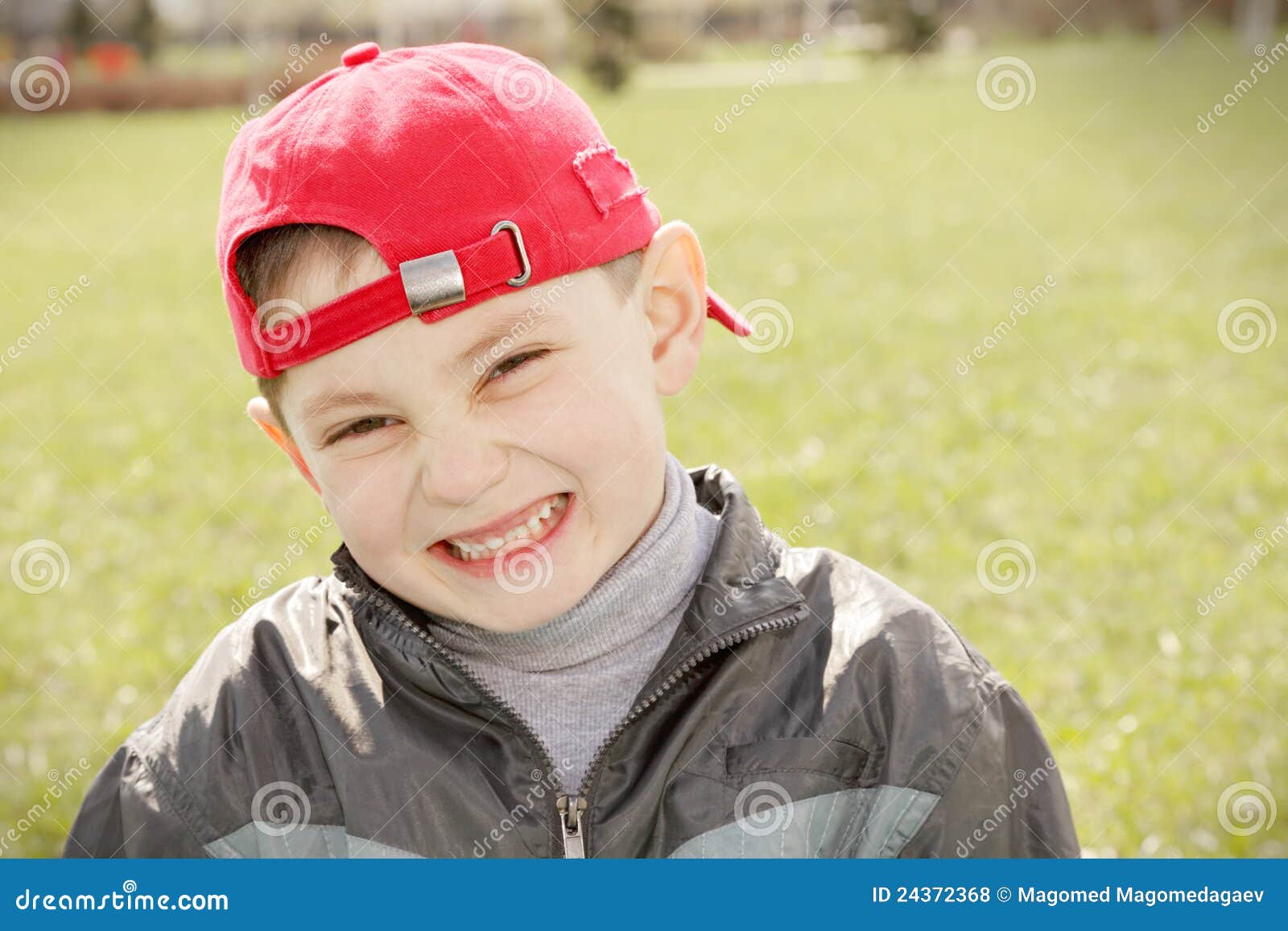 Smiling kid in red cap stock photo. Image of child, face - 24372368