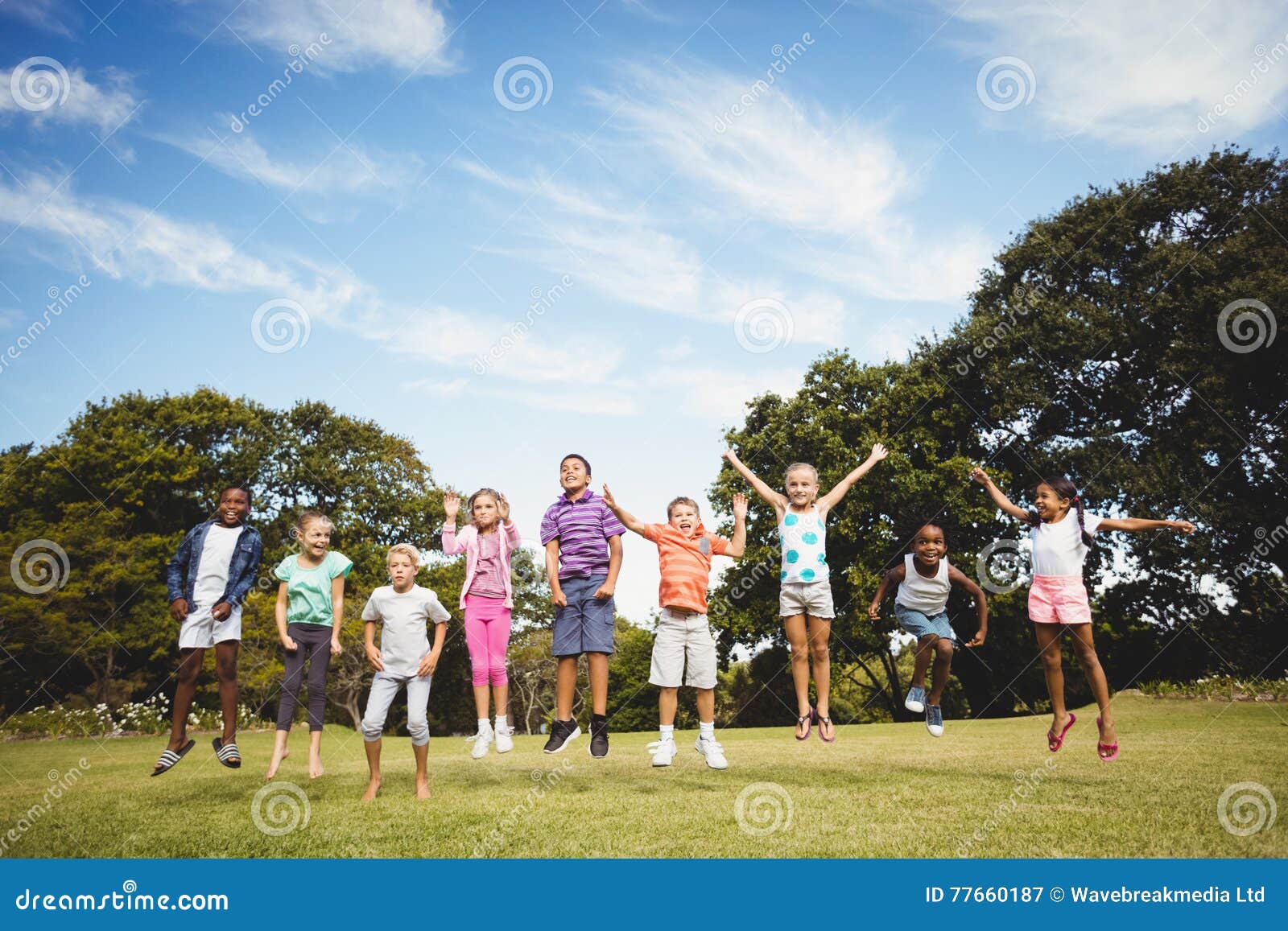 Smiling Kids Jumping Together during a Sunny Day Stock Image - Image of ...