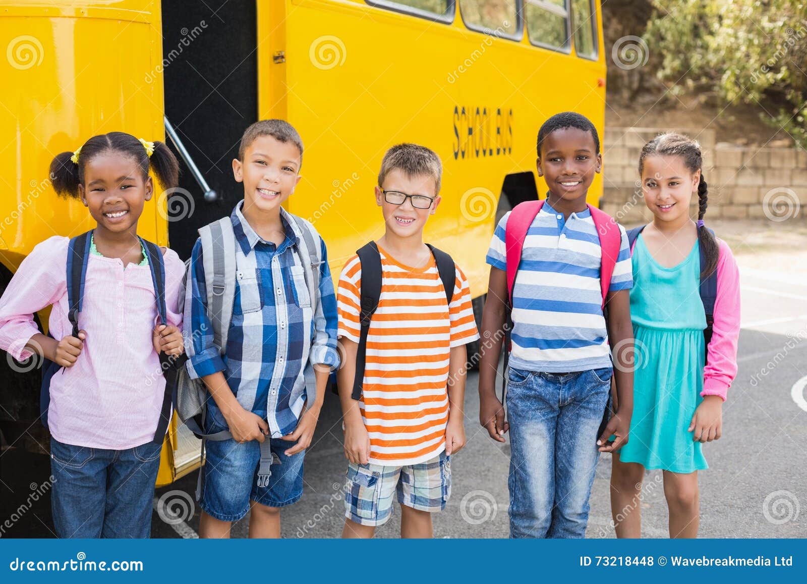 Smiling Kids Standing Together in Front of School Bus Stock Photo ...