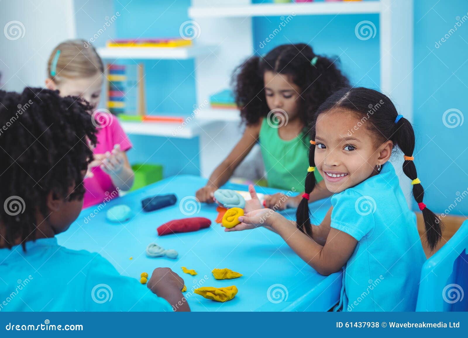 Smiling Kids Using Modelling Clay Stock Photo - Image of front, desk ...