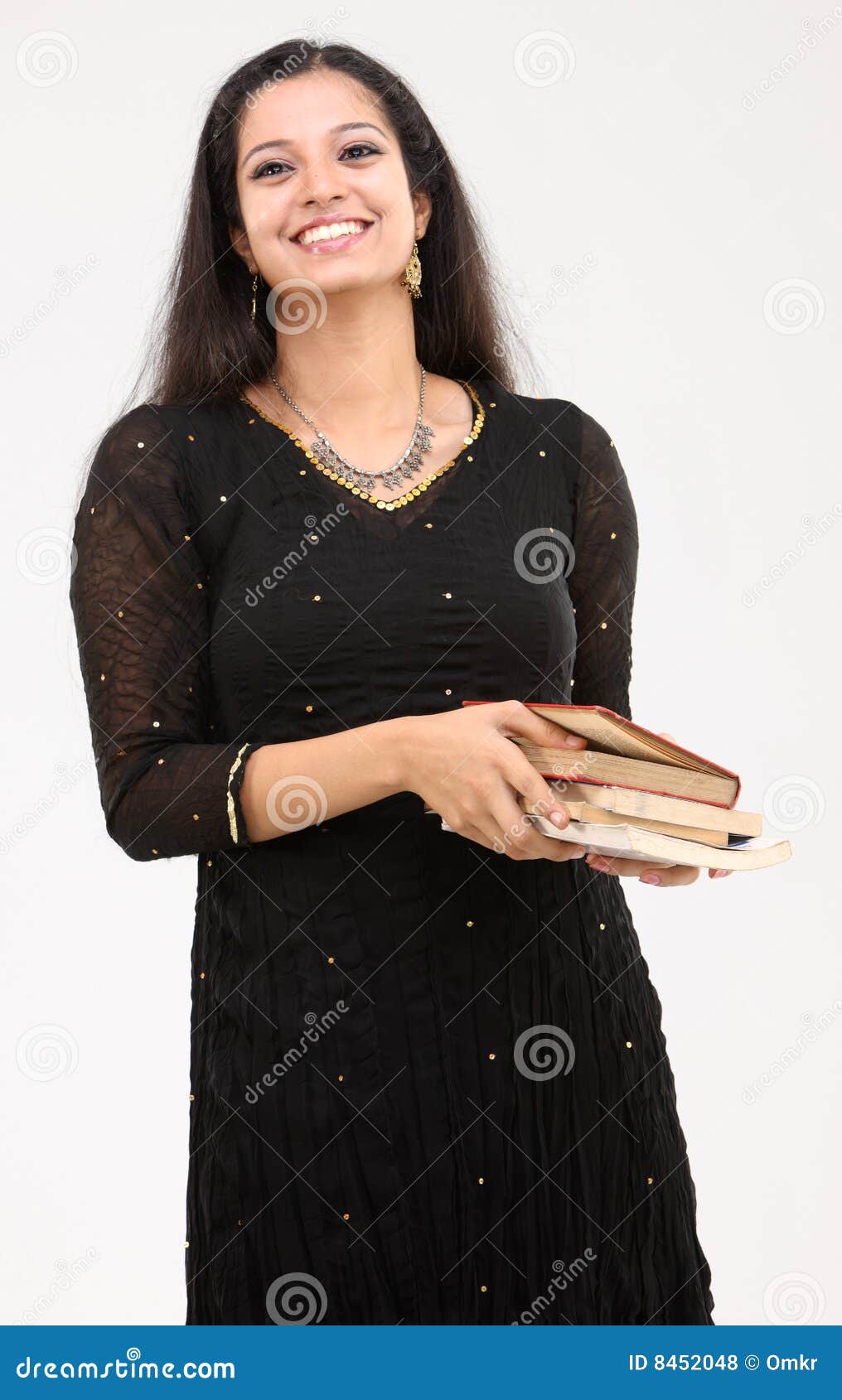 Smiling lady with books stock photo. Image of brunette - 8452048