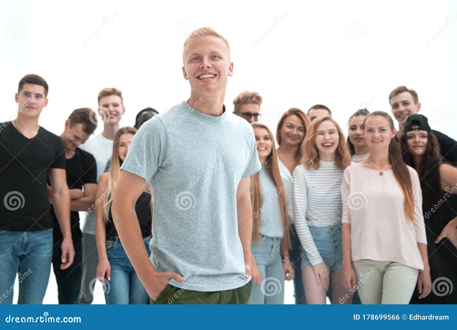Smiling Leader Standing in Front of a Casual Group of Young People ...