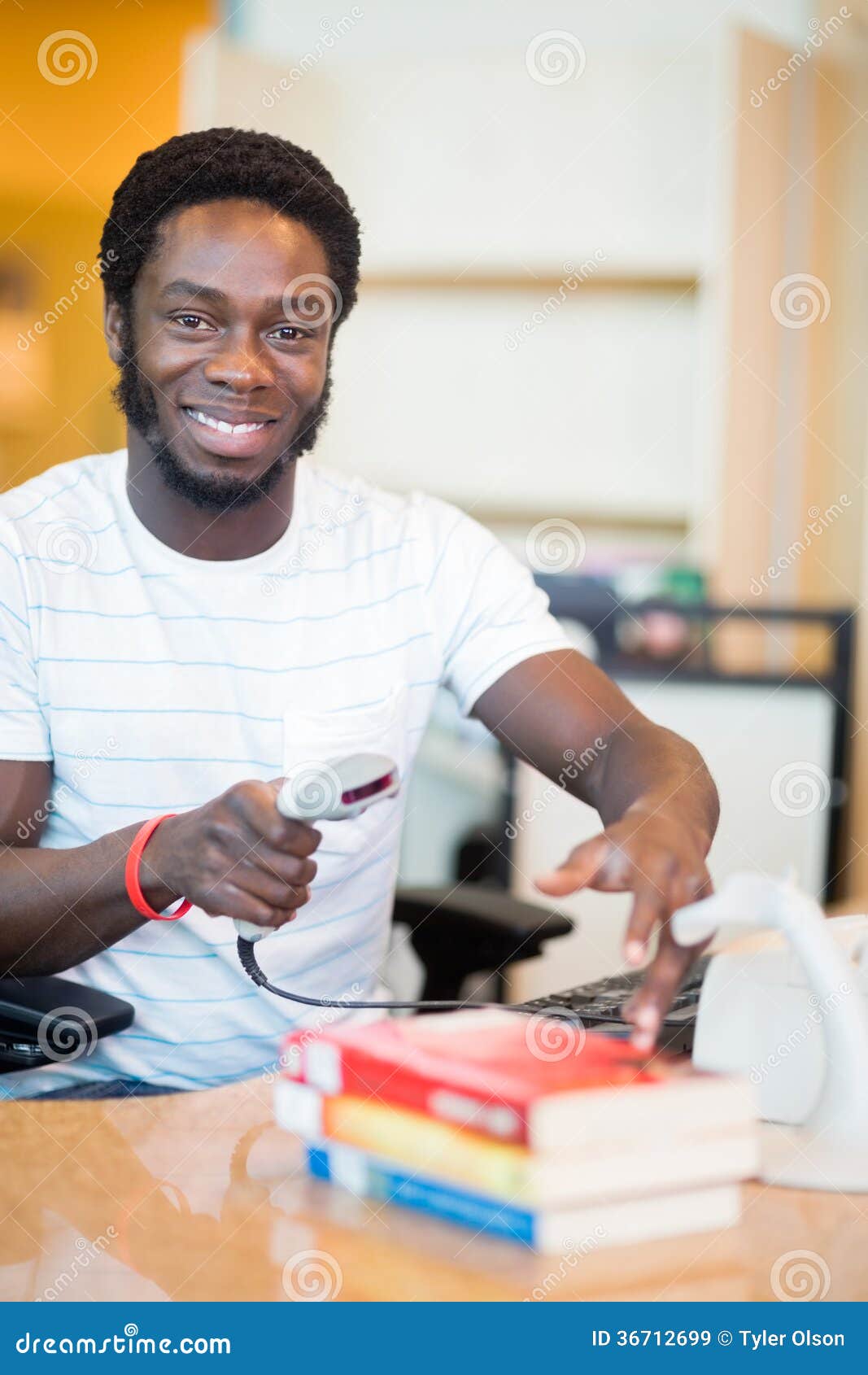 Smiling Librarian Scanning Books at Library Desk Stock Image - Image of ...