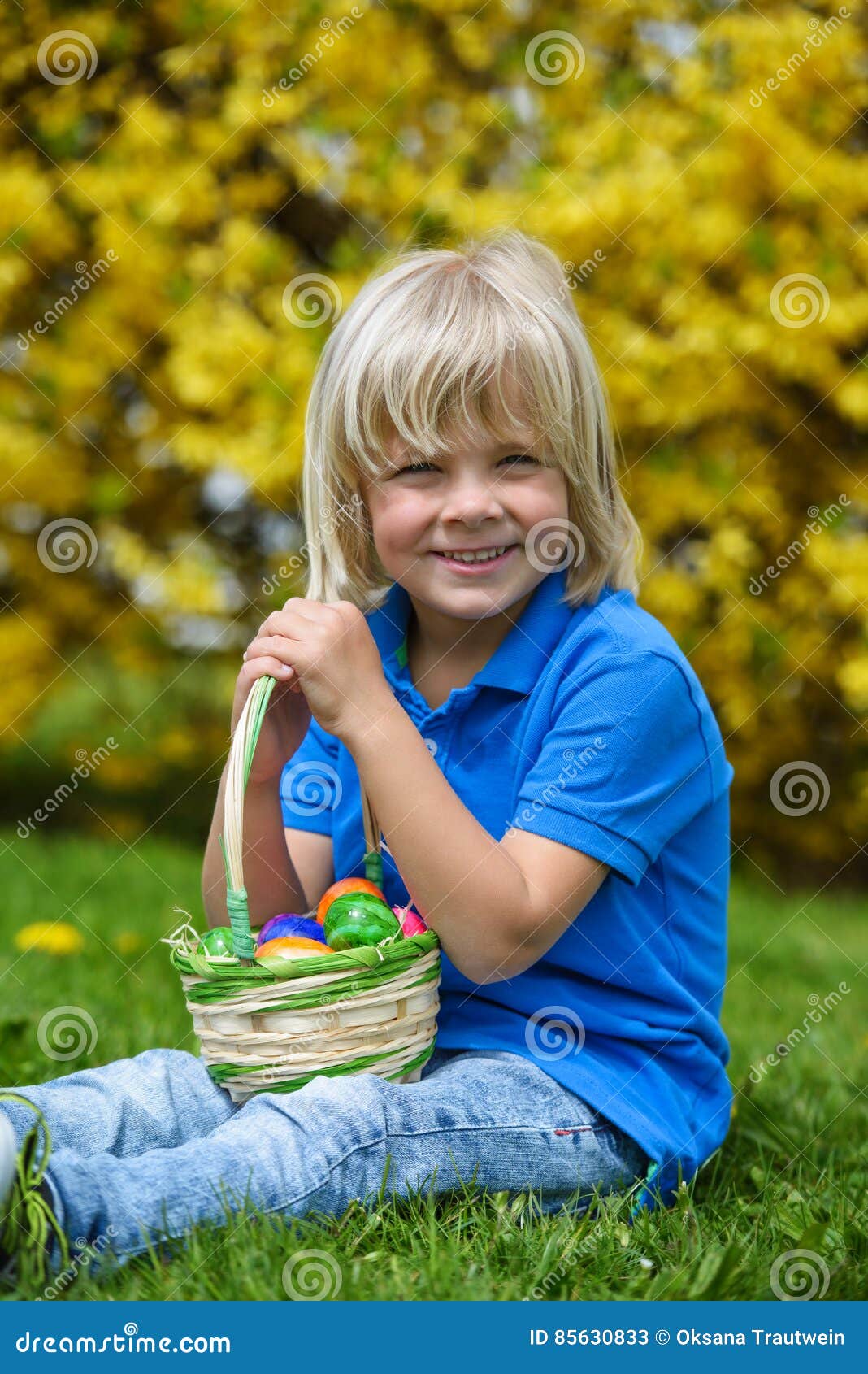 Smiling Little Boy with Basket Full of Colorful Easter Eggs Outdoors ...