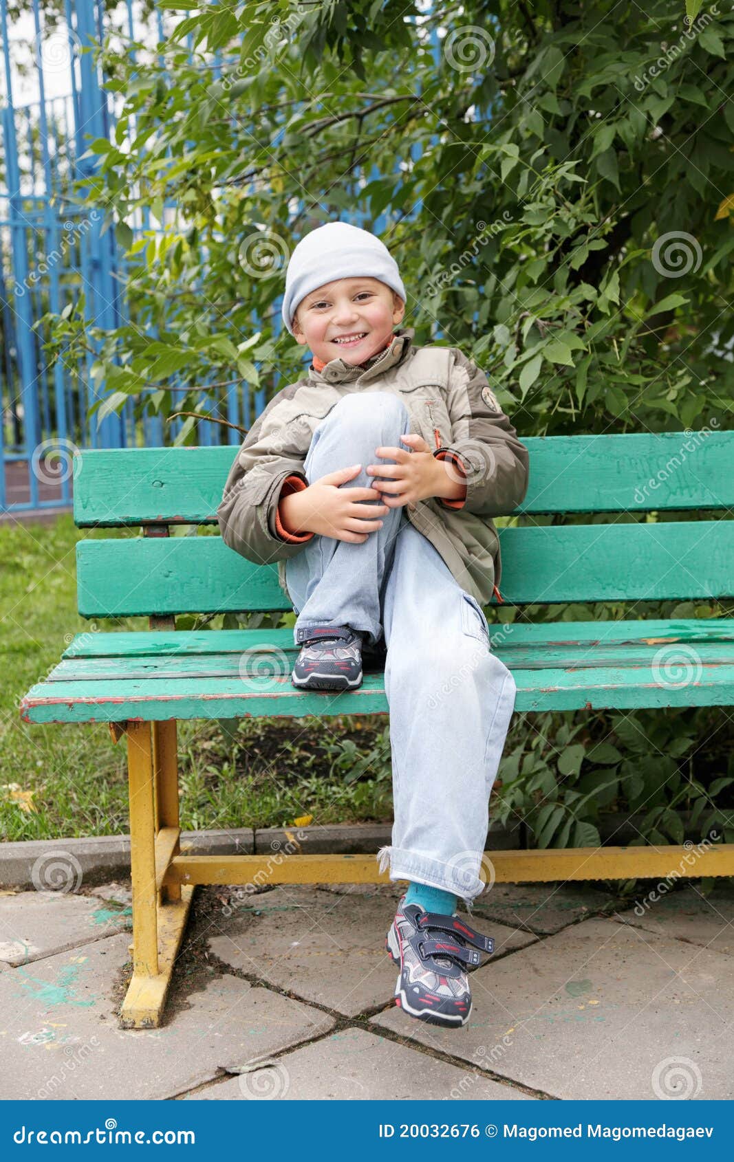 Smiling Little Boy on Bench Stock Photo - Image of casual, person: 20032676