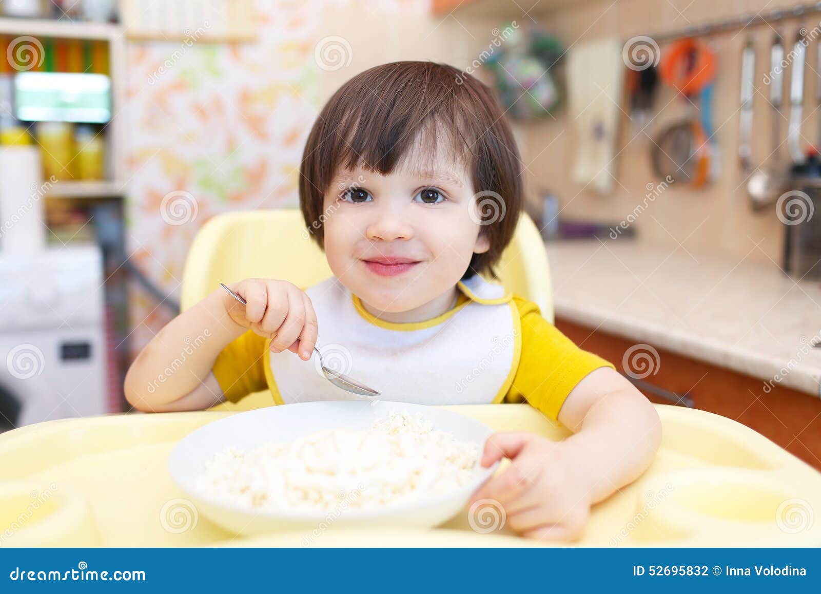 Smiling Little Boy Eats Quark with Sour Cream Stock Photo - Image of ...
