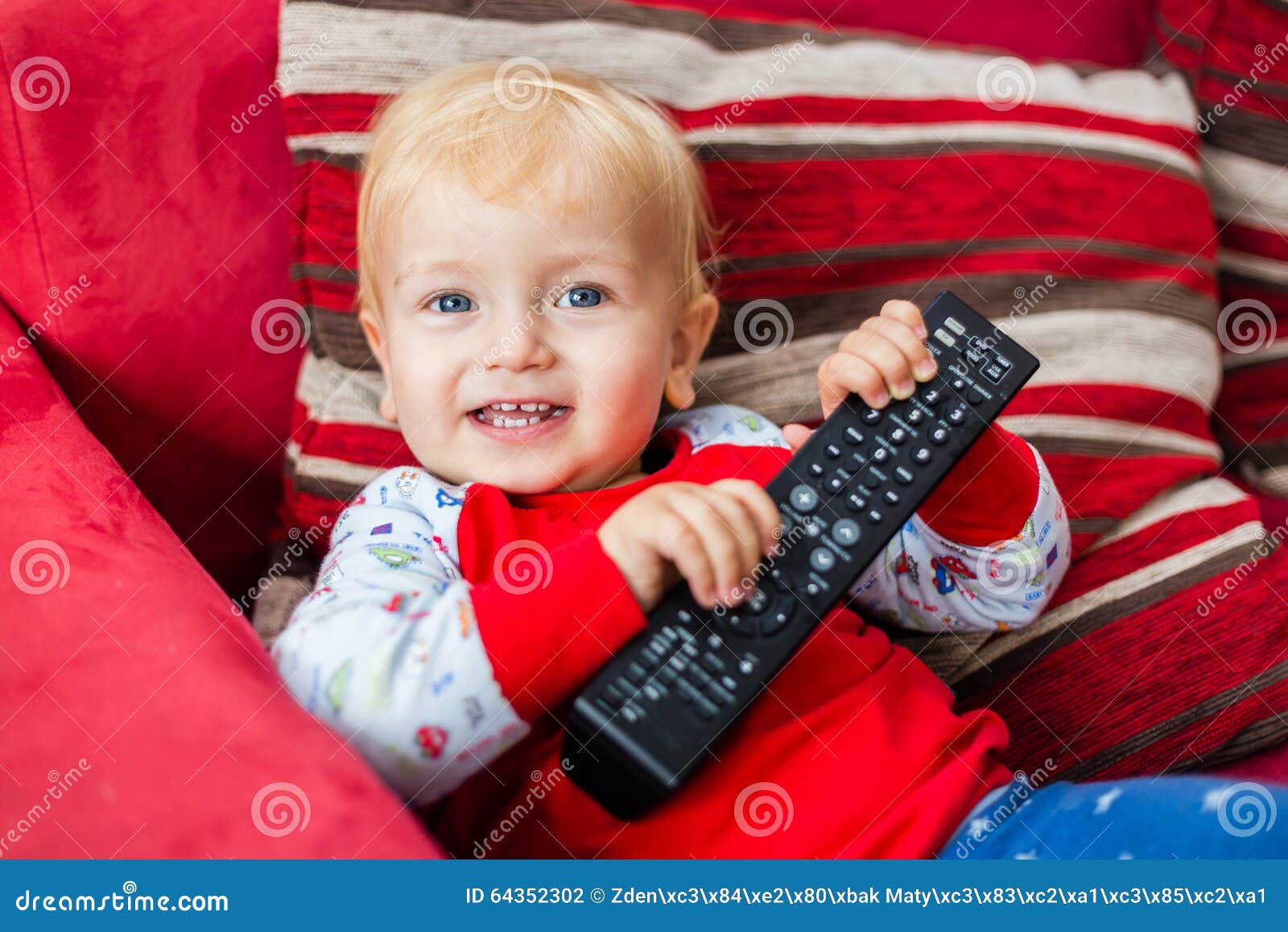 Smiling Little Boy Holding Remote Control Stock Photo - Image of ...