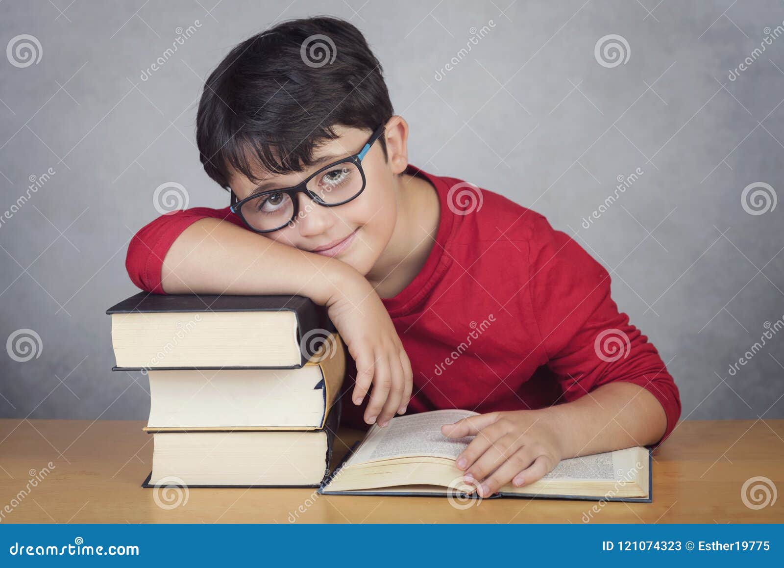 Smiling Little Boy Leaning on Books Stock Image - Image of caucasian ...