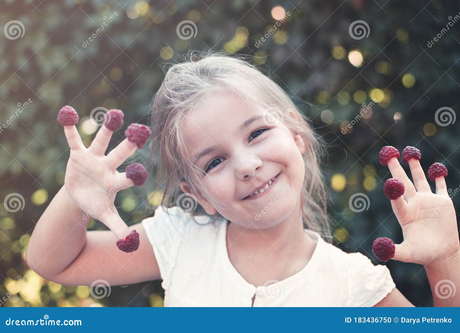 Smiling Little Child with Raspberry Outdoors Stock Photo - Image of ...