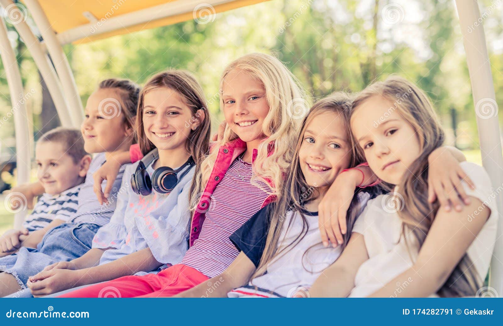 Smiling Little Friends Sit Hugging on the Swing Stock Image - Image of ...