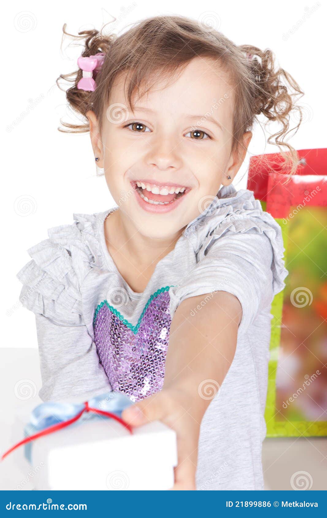 Smiling Little Girl Giving You a Present in Studio Stock Photo - Image ...