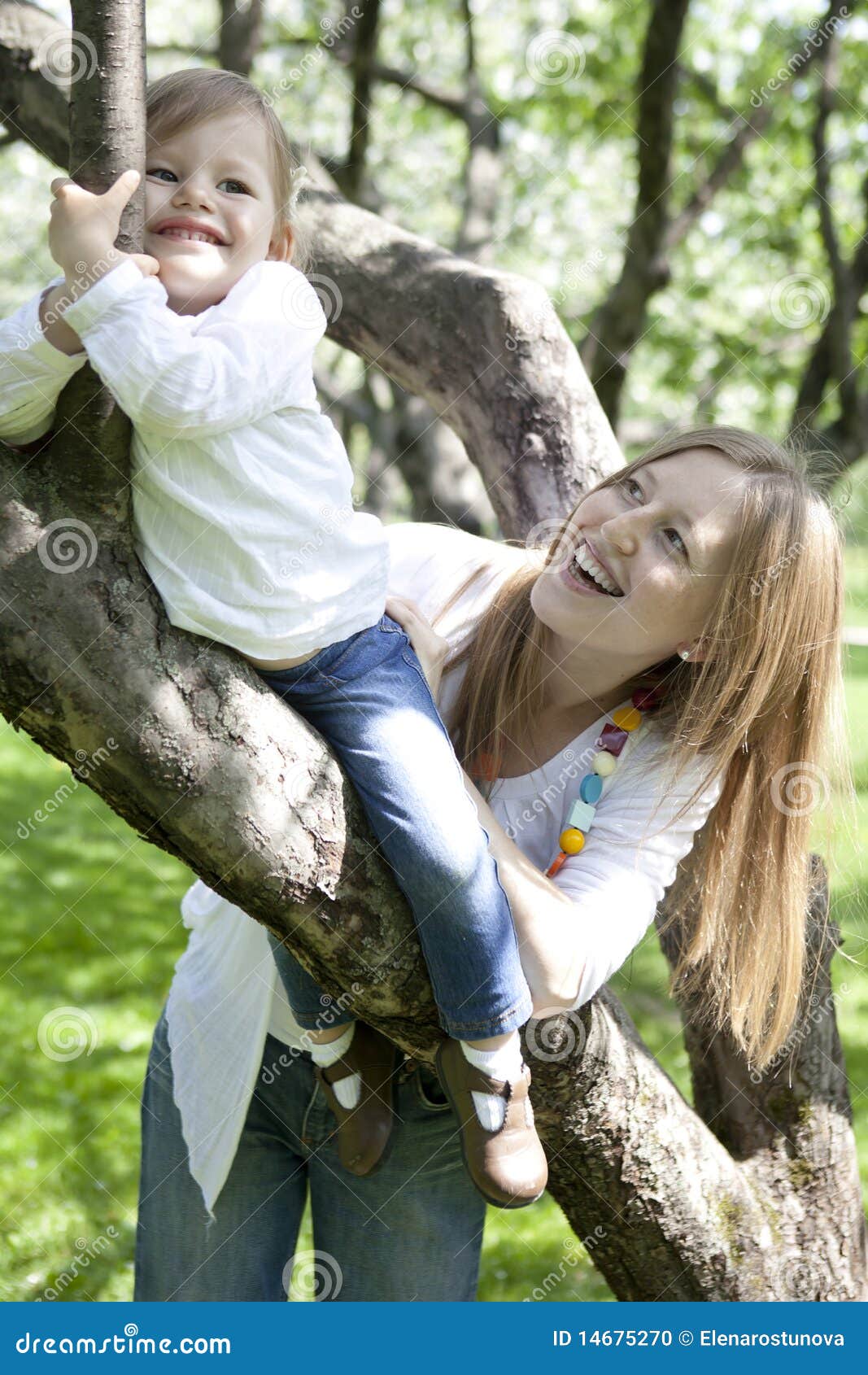 Smiling Little Girl Hold for Tree Stock Photo - Image of outdoor, smile ...