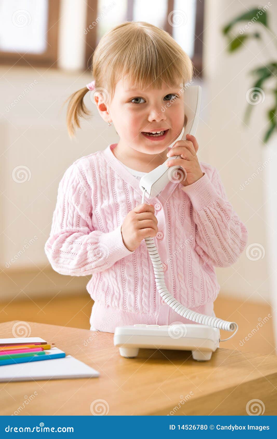 Smiling Little Girl on Phone in Lounge Stock Photo - Image of telephone ...