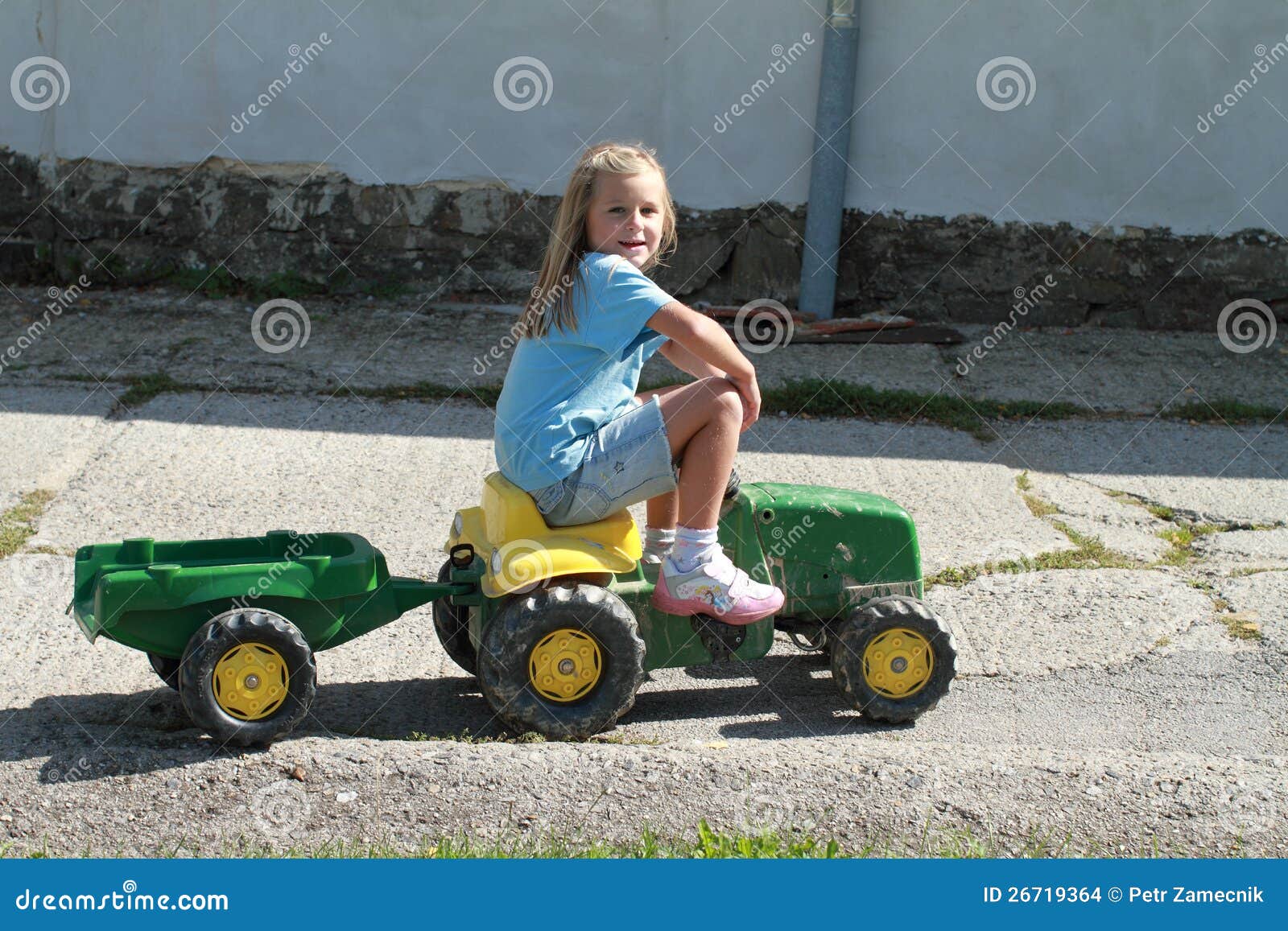 Smiling Little Girl Riding a Tractor Editorial Stock Image - Image of ...