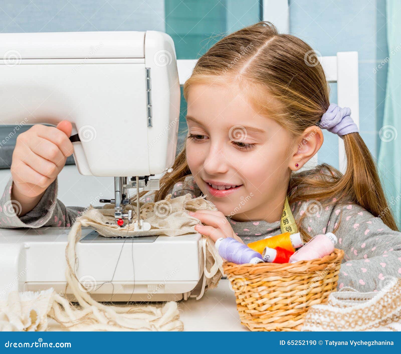 Smiling Little Girl at the Table with Sewing Stock Photo - Image of ...