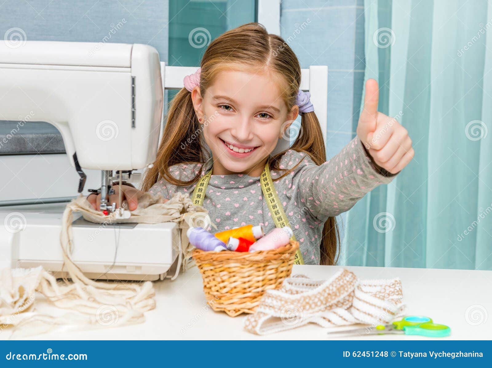 Smiling Little Girl at the Table with Sewing Stock Photo - Image of ...