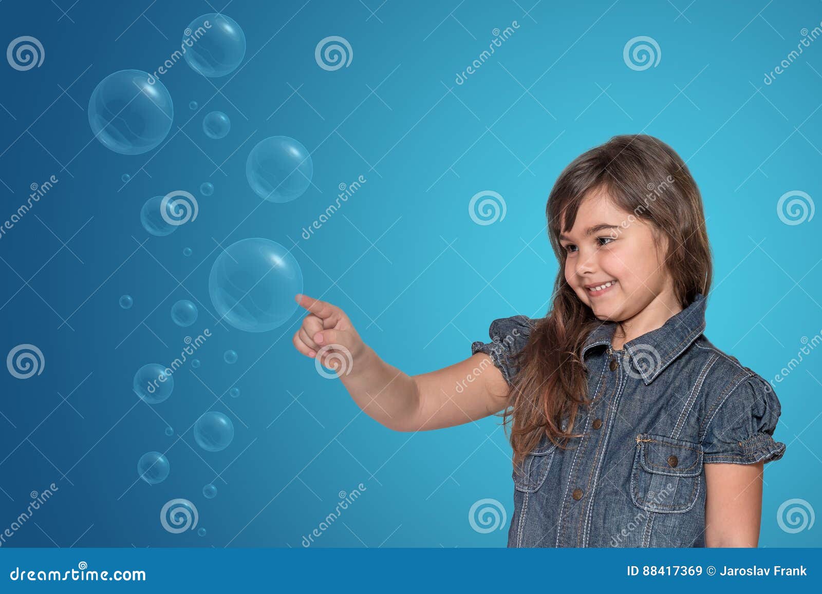 Smiling Little Girl is Touching the Transparent Bubbles Stock Image ...