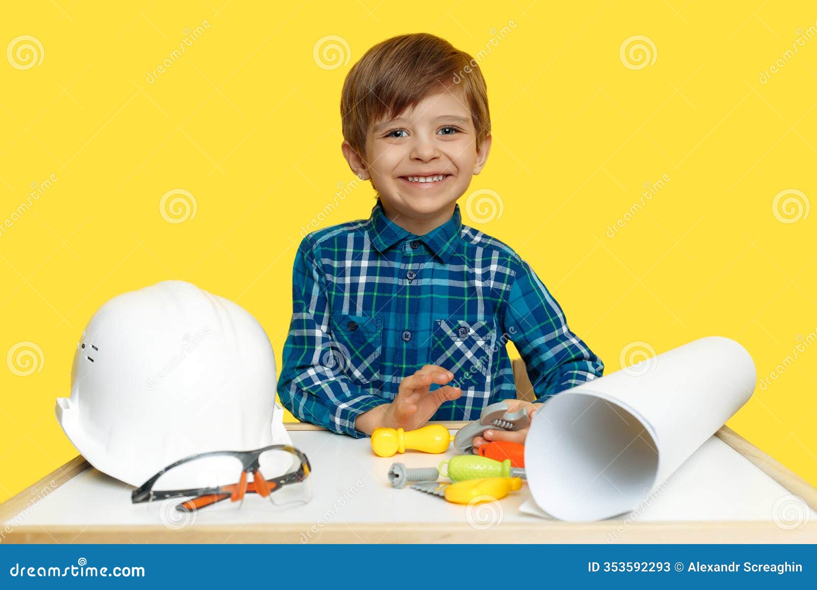 Smiling Little Kid Boy Engineer or Architect Sitting at the Work Table ...