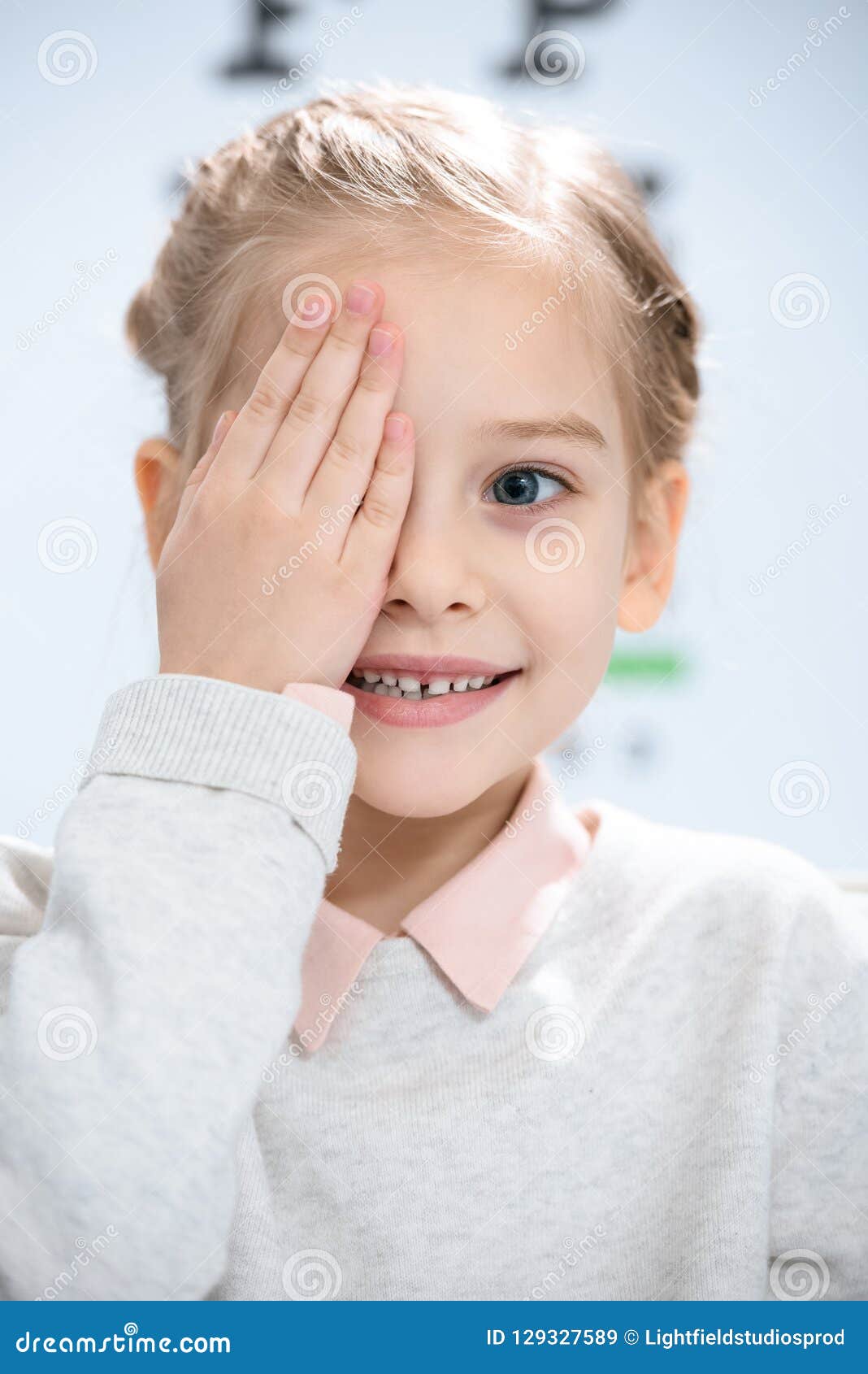 Smiling Little Kid Closing Eye with Eye Stock Image - Image of clinical ...