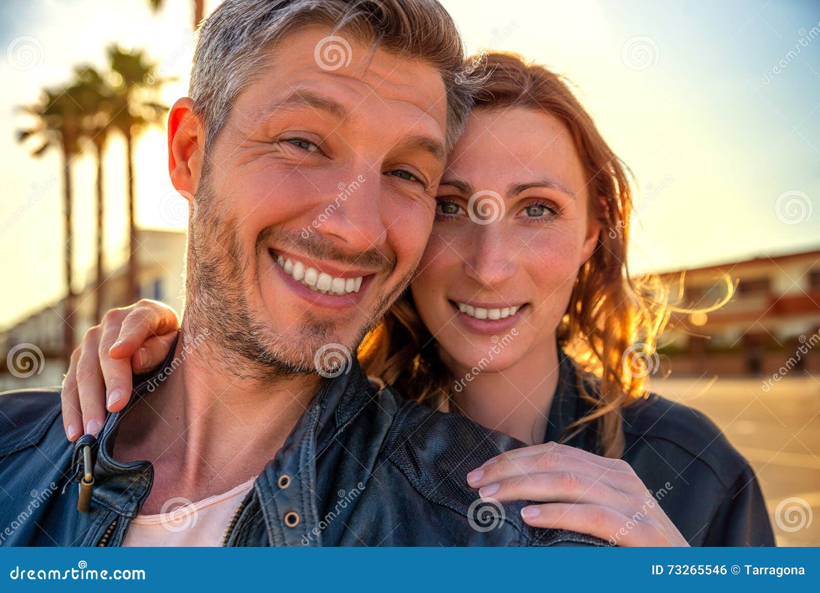 Smiling lovers couple stock photo. Image of beach, city - 73265546