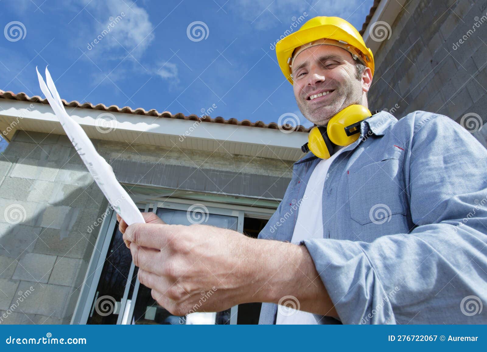 Smiling Male Architect Holding Plans Outside Property Stock Image ... Smiling Male Architect Holding Plans Outside Property Stock Image ...