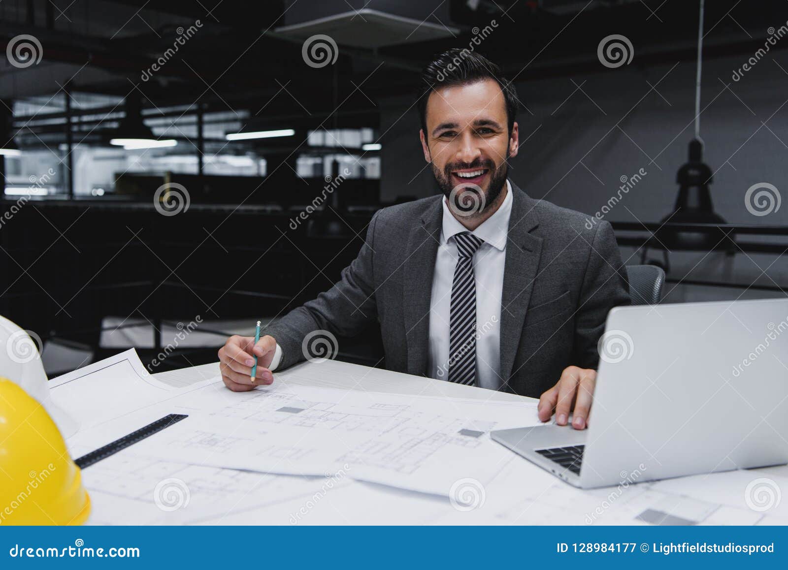 Smiling Male Architect Working with Blueprints Stock Image - Image of ...