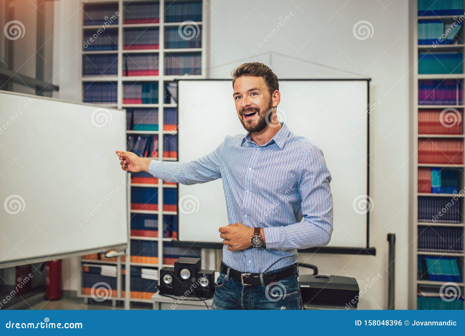 Male Coach Giving Presentation for Audience in Lecture Hall Stock Photo ... Male Coach Giving Presentation for Audience in Lecture Hall Stock Photo ...