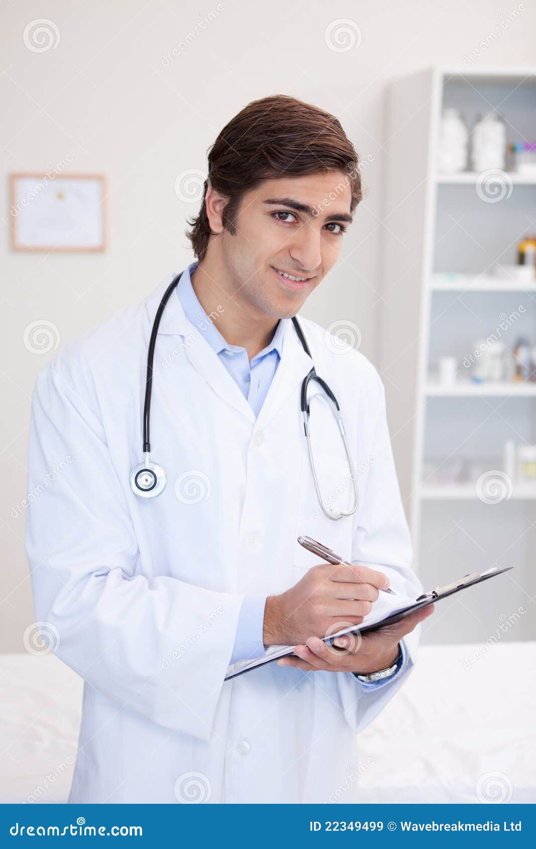 Smiling Male Doctor Taking Notes Stock Image - Image of caucasian ...