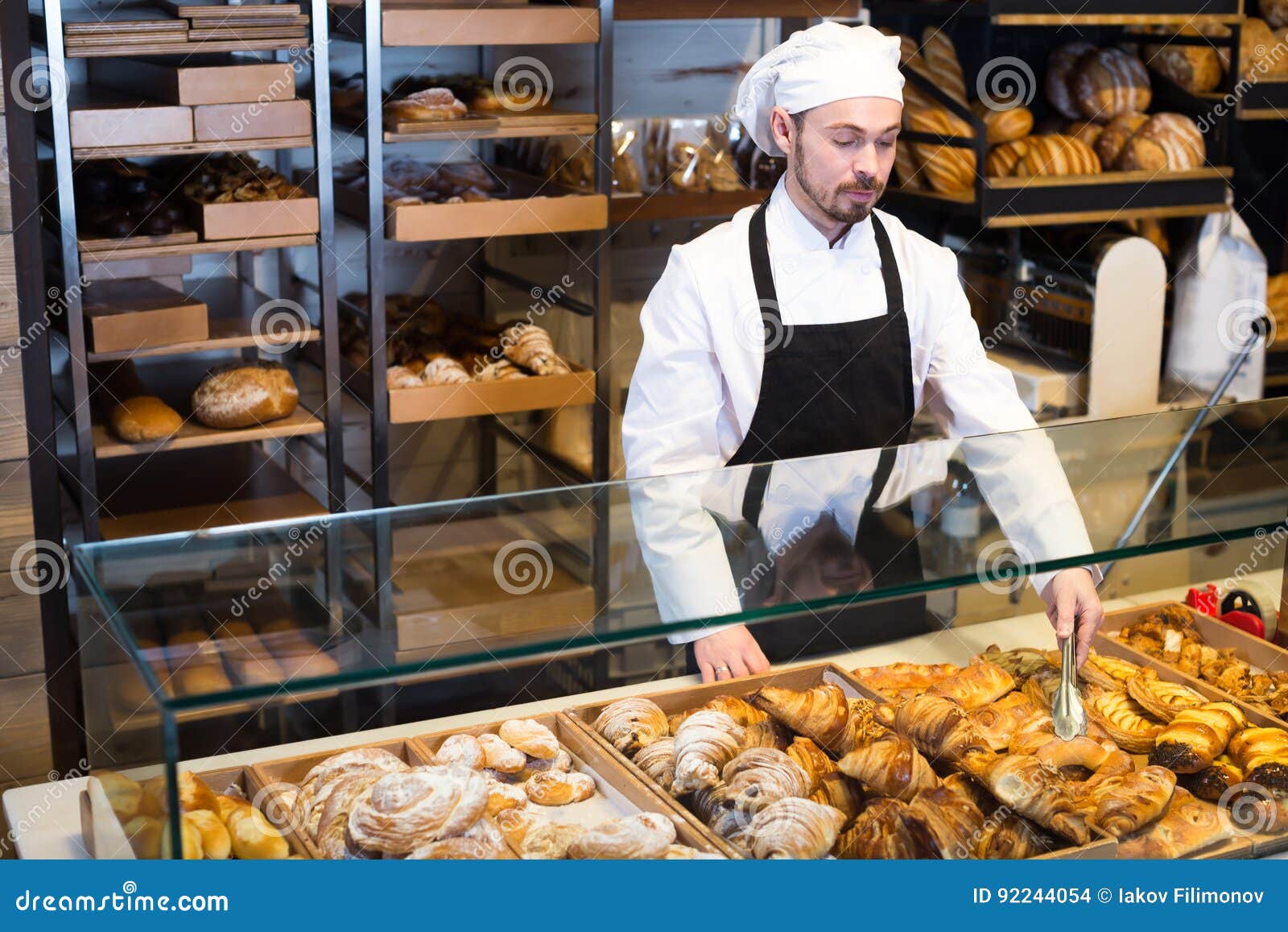 Smiling Male Pastry Maker Demonstrating Croissant Stock Photo - Image ...