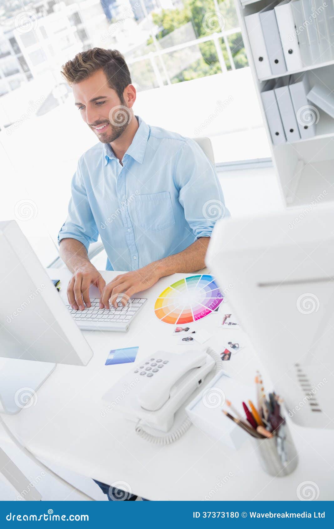 Smiling Male Photo Editor Using Computer Stock Photo - Image of table ...