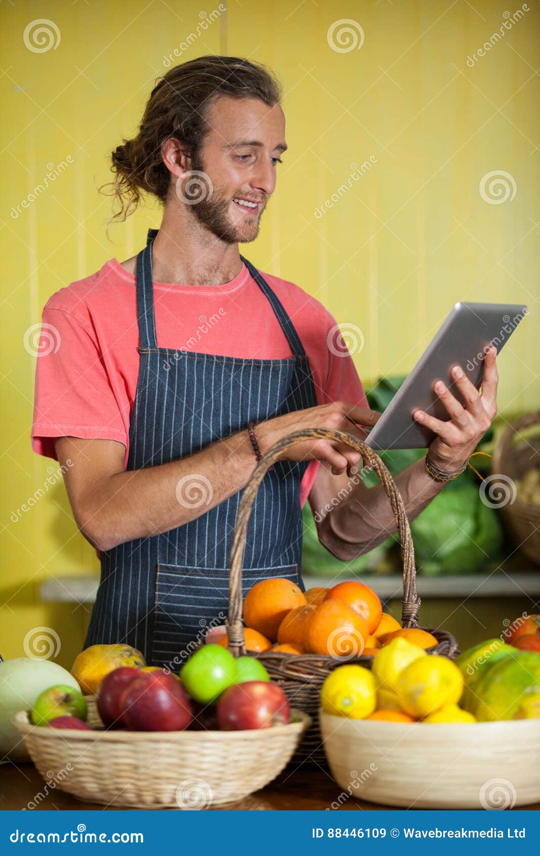 Smiling Male Staff Using Digital Tablet in Organic Section Stock Image ...