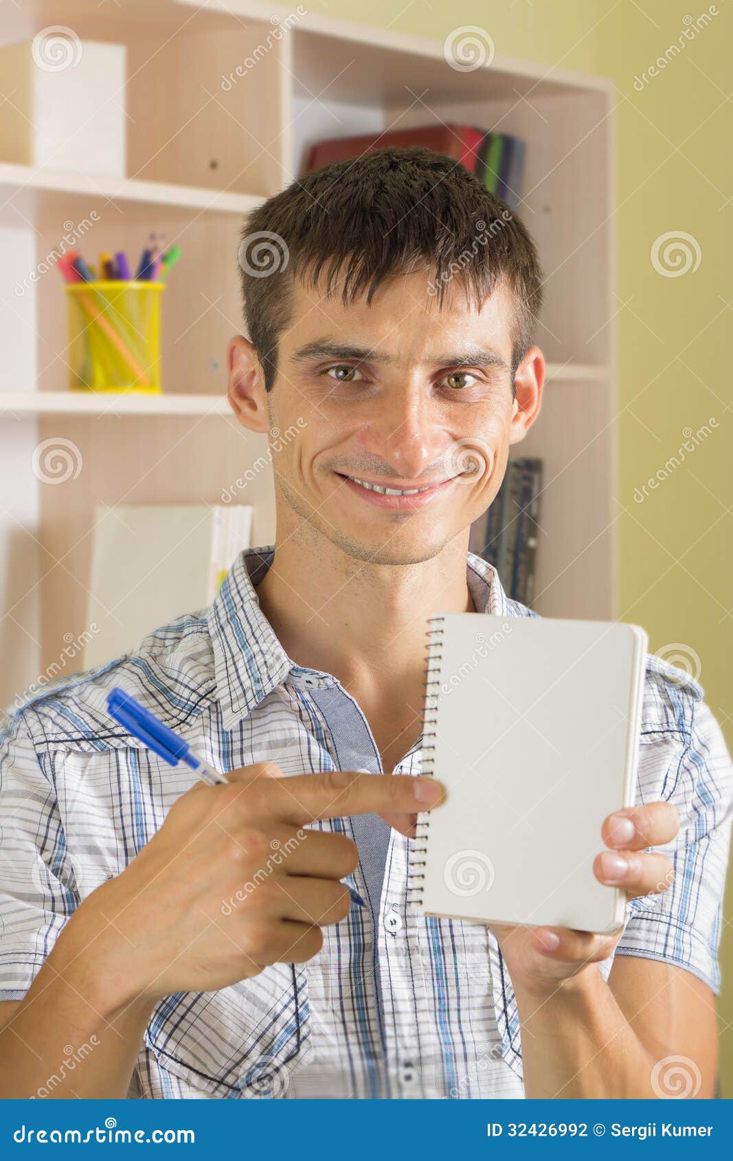 Smiling Male Student with Notebook Stock Photo - Image of male, showing ...