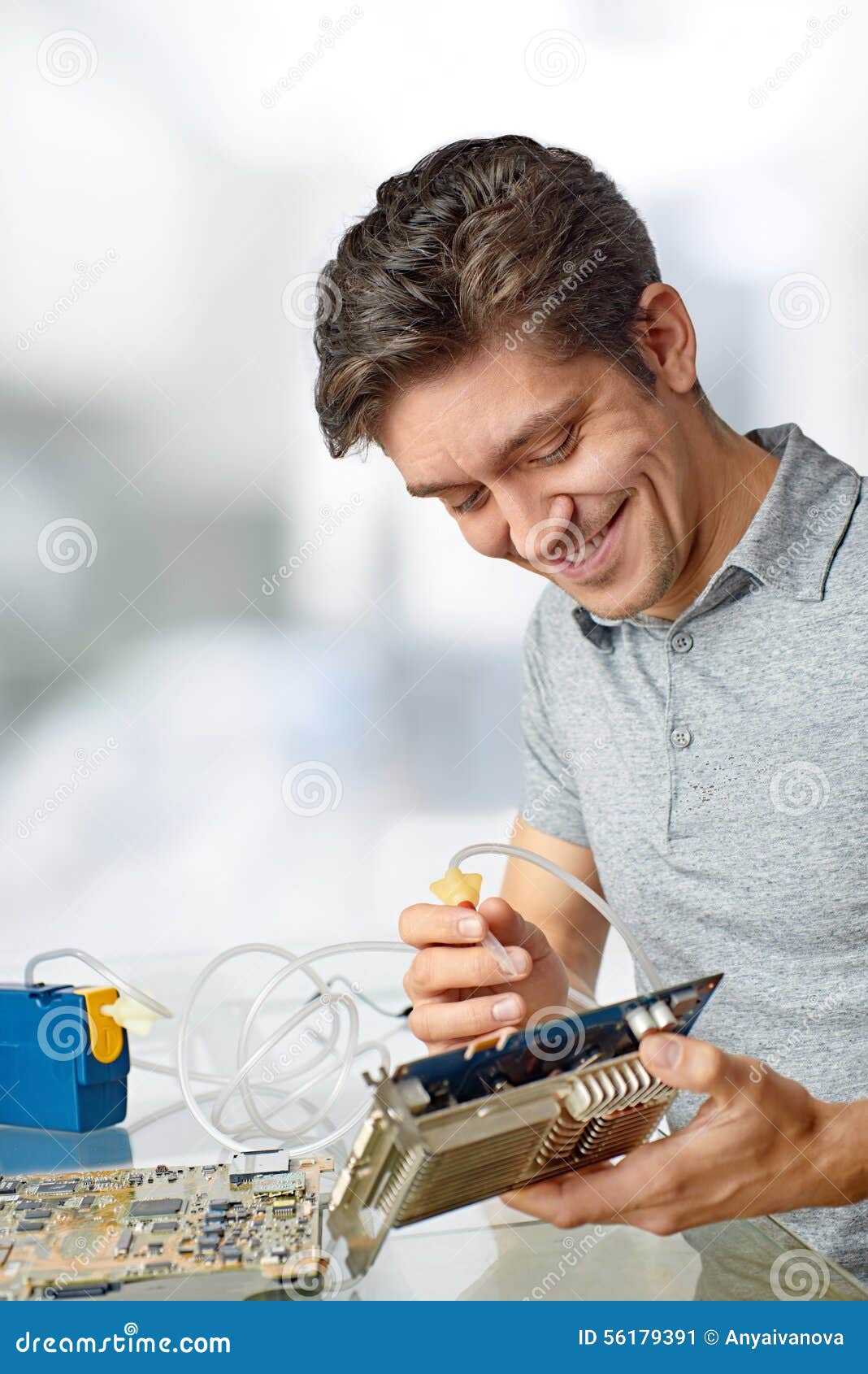 Smiling Male Tech Cleans Faulty Computer Processor Stock Image - Image ...