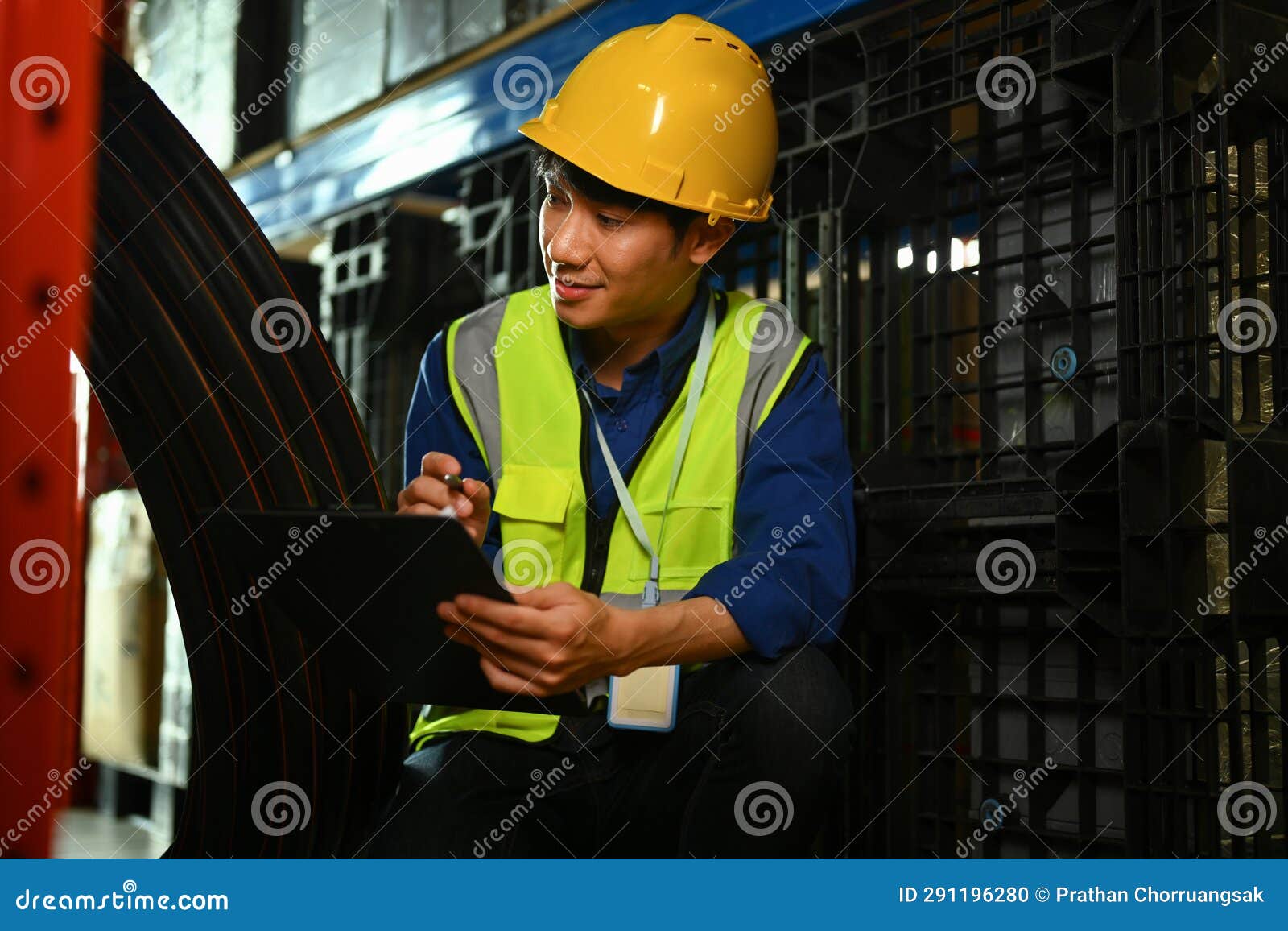 Smiling Male Worker Checking Quantity of Tubes in the Retail Warehouse ...