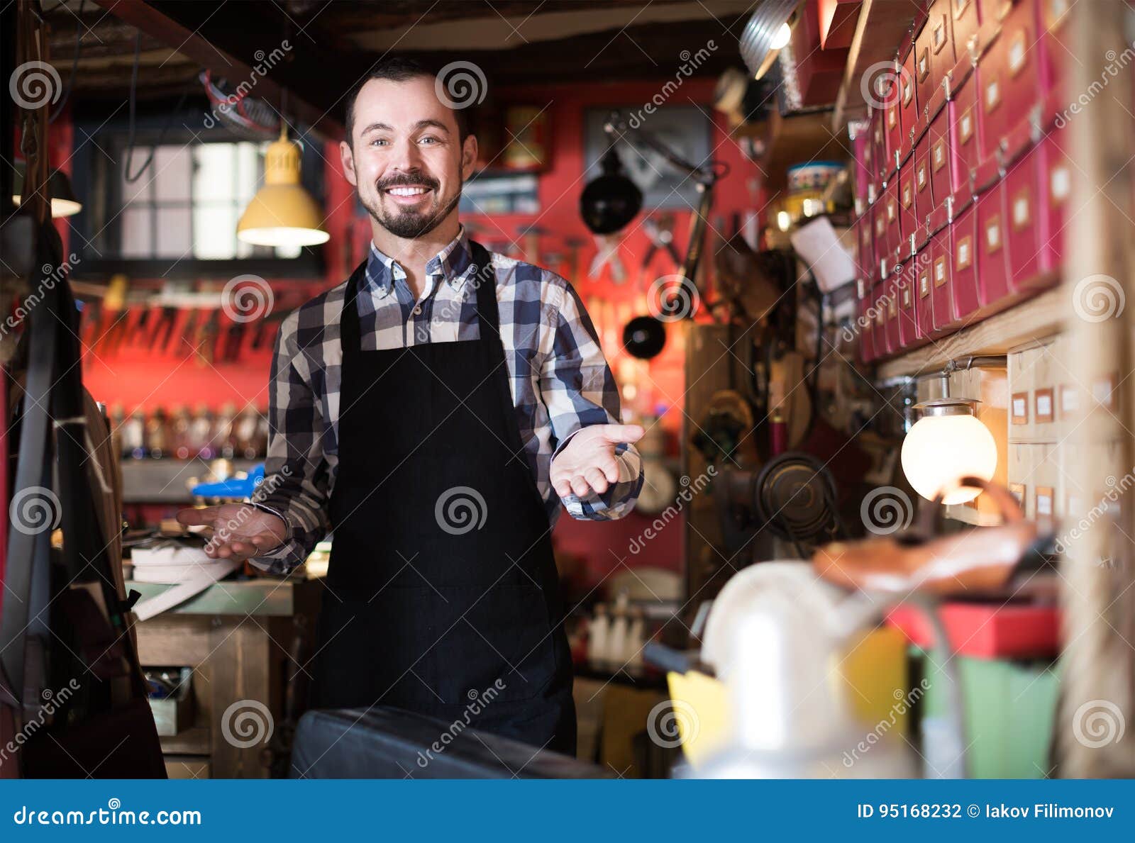Smiling Male Worker Demonstrating His Workplace Stock Photo - Image of ...