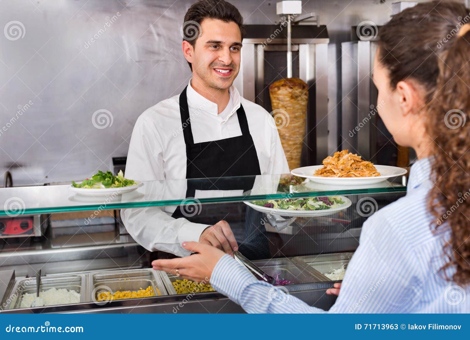 Smiling Male Worker Serving Customer with Smile at Shawarma Place Stock ...