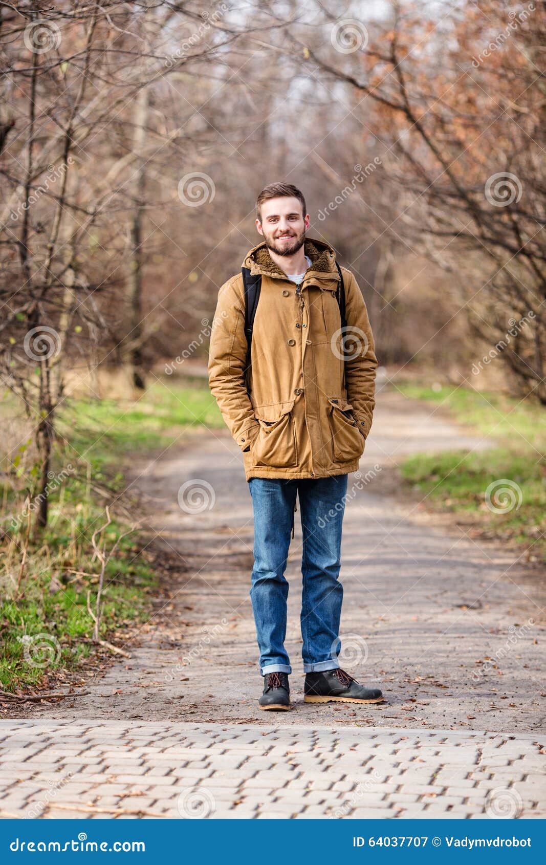 Smiling Man with Backpack Standing Outdoors Stock Image - Image of ...