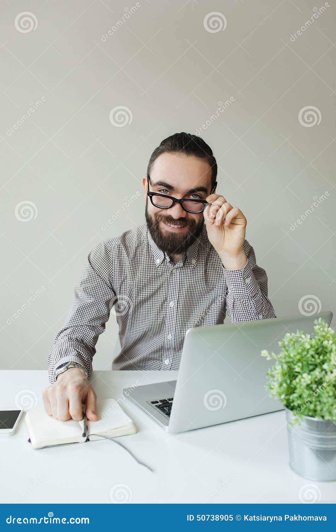 Smiling Man with Beard in Glasses Taking Notes with Laptop Notepad ...