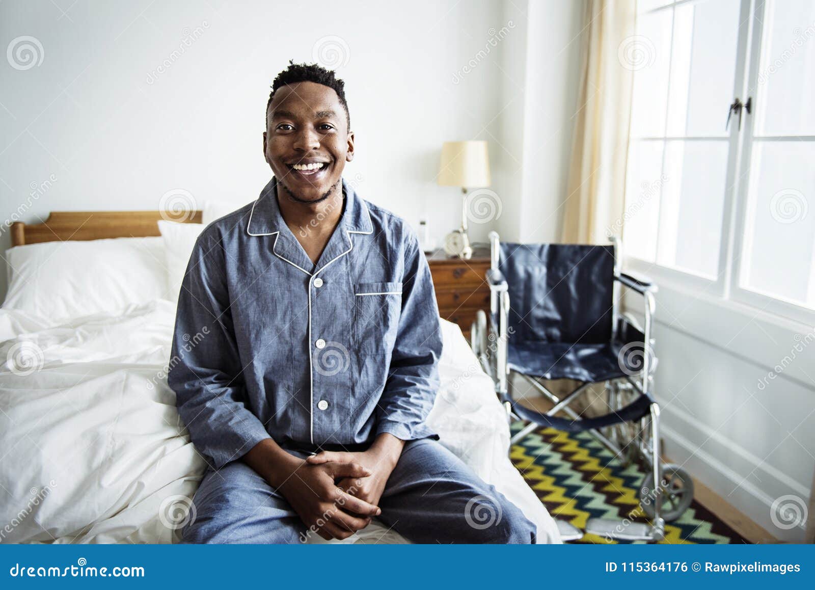 A smiling man in bed stock photo. Image of america, happiness - 115364176