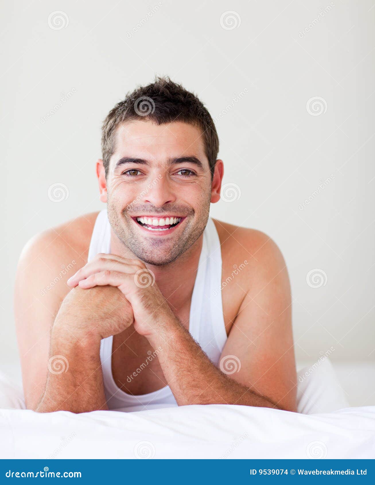 Smiling man in bed stock photo. Image of resting, human - 9539074