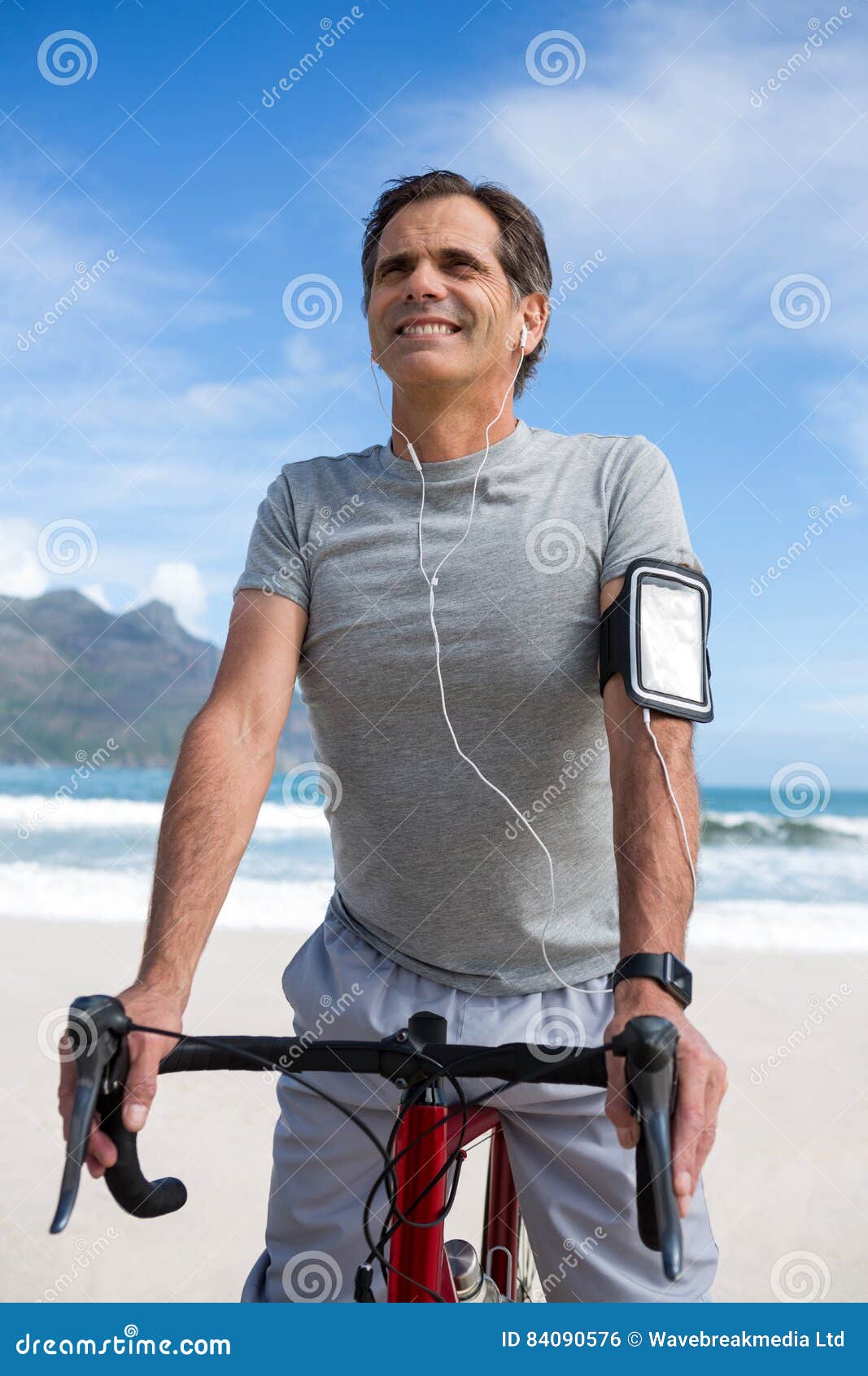 Smiling man with bicycle stock photo. Image of communication - 84090576