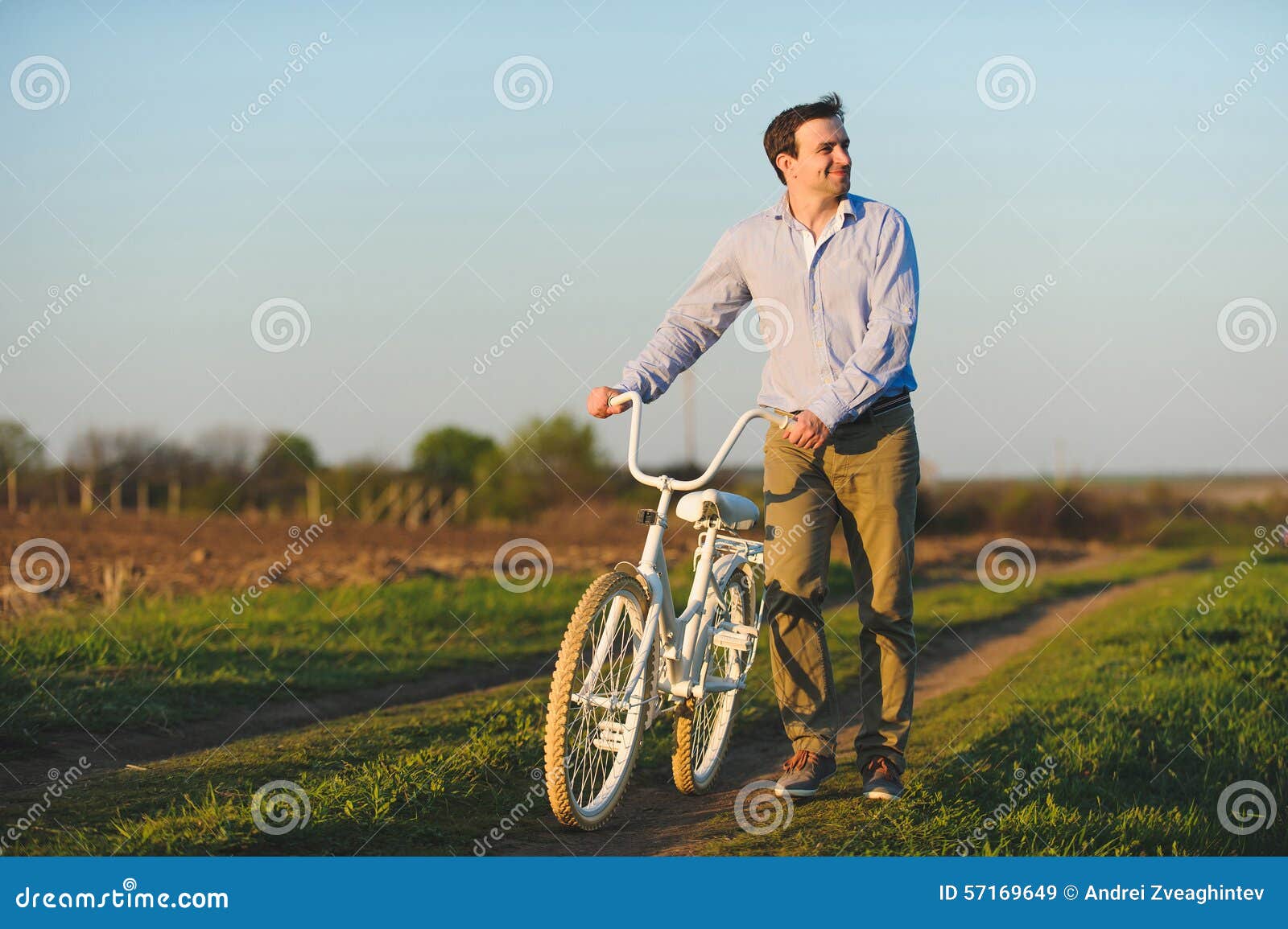 Smiling Man with Bicycle stock image. Image of relaxation - 57169649