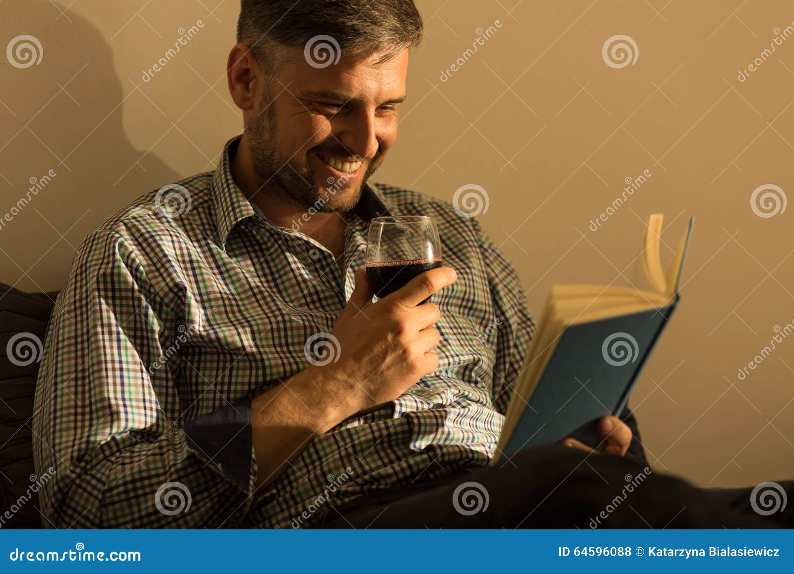 Smiling man with book stock photo. Image of reading, comedy - 64596088