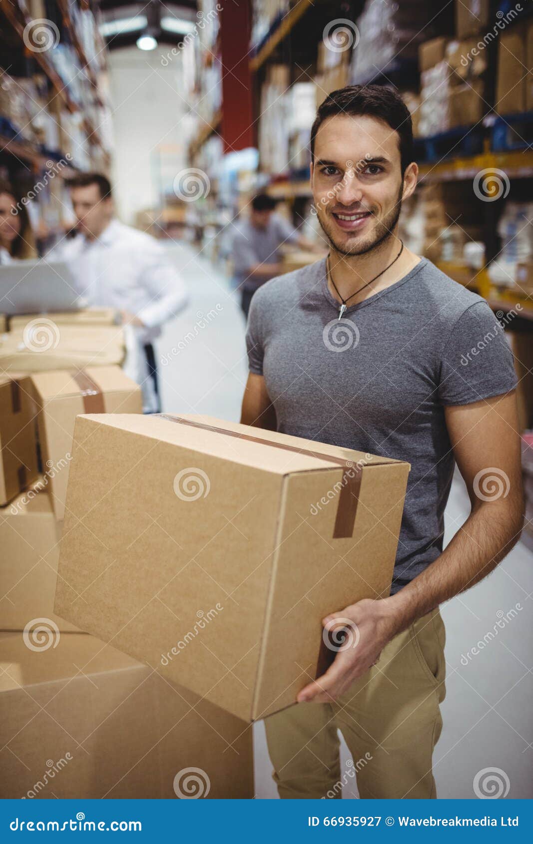 Smiling man carrying box stock image. Image of four, businessman - 66935927