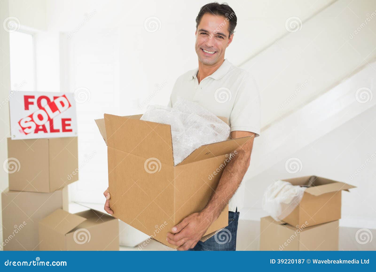 Smiling Man Carrying Boxes in a New House Stock Image - Image of ...