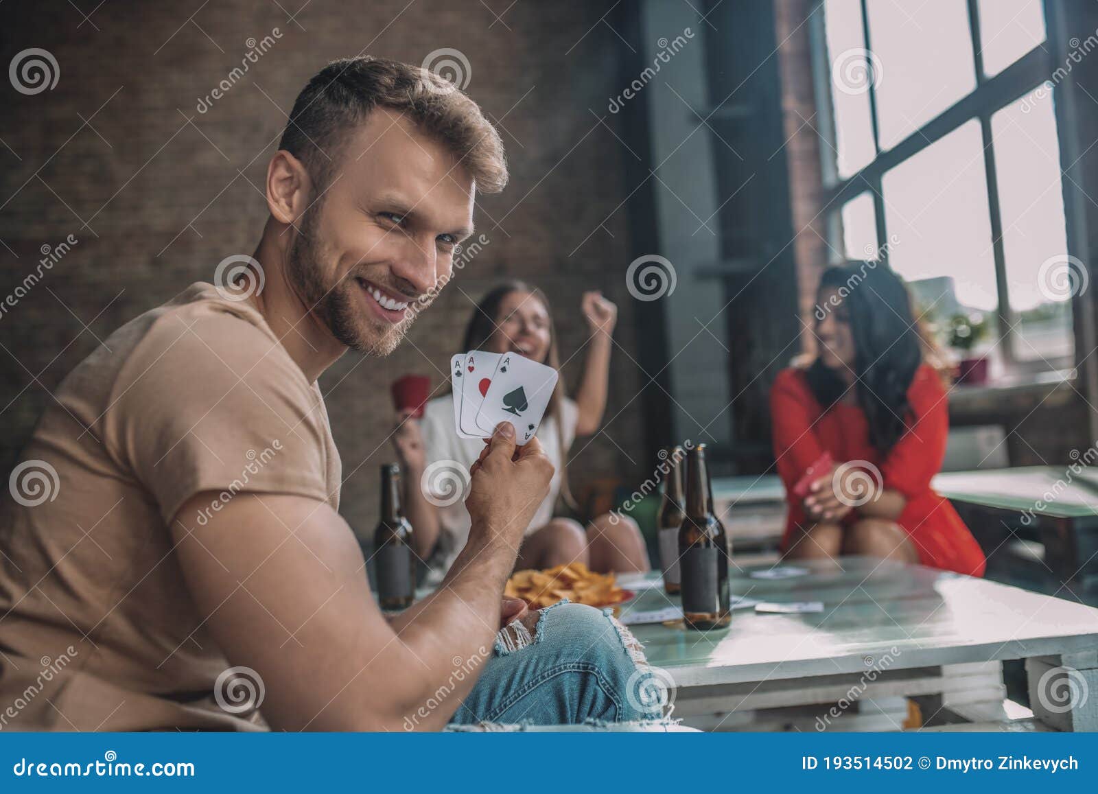 Smiling Man Cheating with an Ace Card while Playing Cards Stock Photo ...