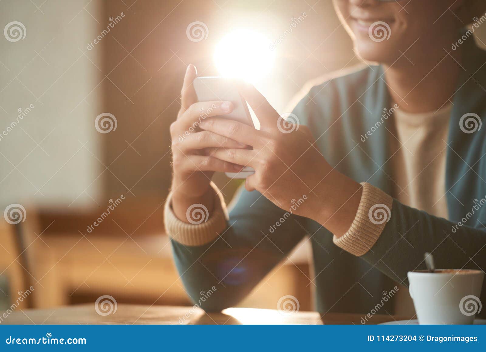 Smiling man checking phone stock photo. Image of enjoying - 114273204