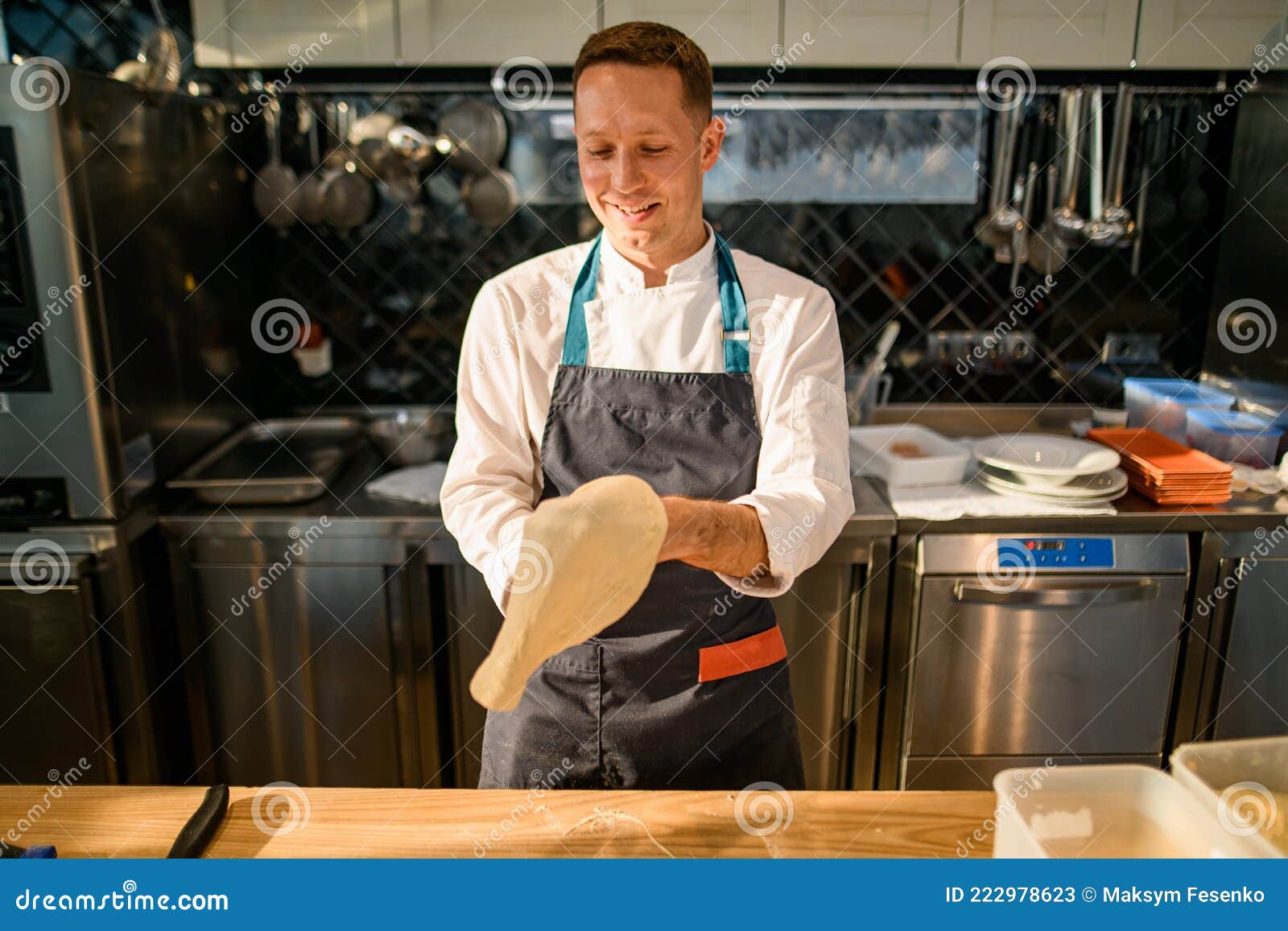 Smiling Man Chef at Kitchen Skilfully Makes Pizza Base Stock Image ...